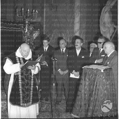 The priest celebrates the mass in suffrage of Mussolini, on the right ...