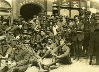 Irish Free State Army soldiers seated and standing in the street of a ...